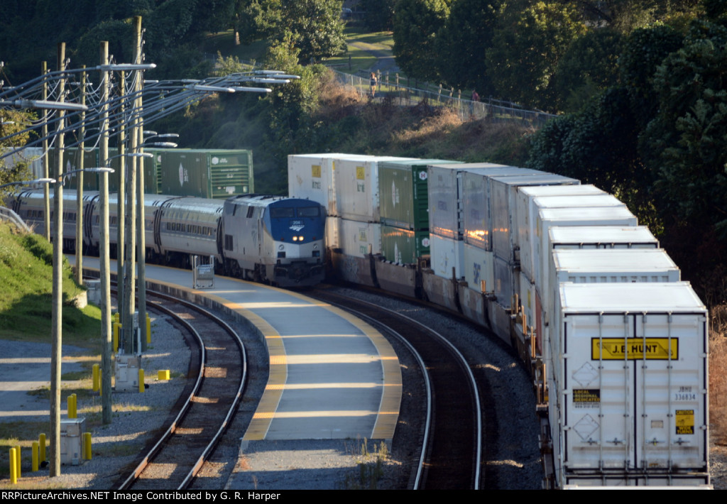 NS train 289 passes by Amtrak Regional 66.